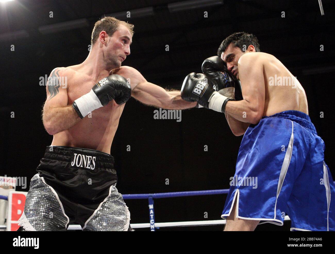 Ben Jones (Crawley, black silver shorts) defeats Sid Razak (blue shorts ...