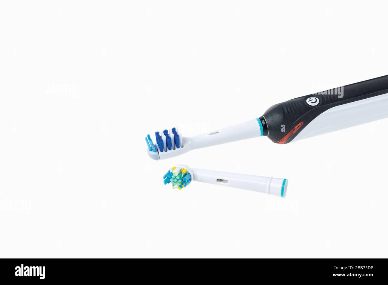 Two kinds of head and toothbrush close up view isolated. Health care ...