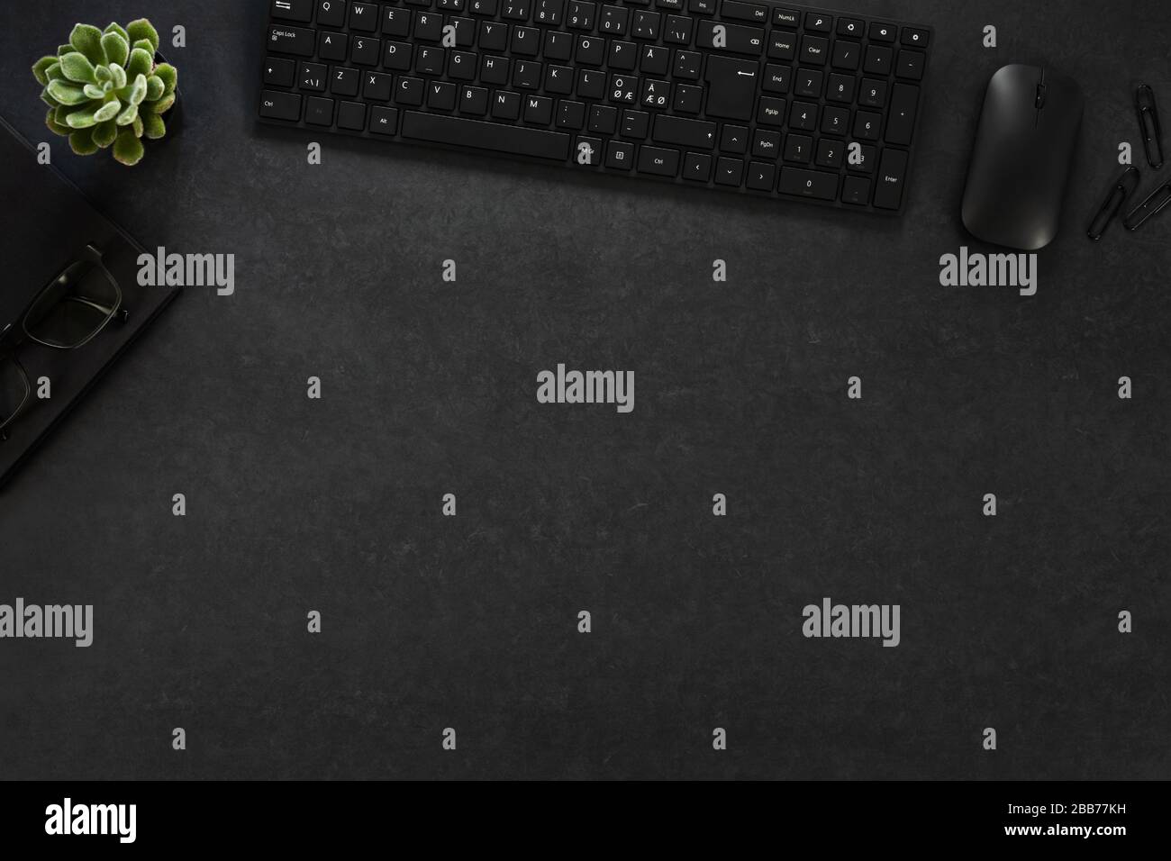 Top view of black concrete office desk with computer and supplies Stock ...