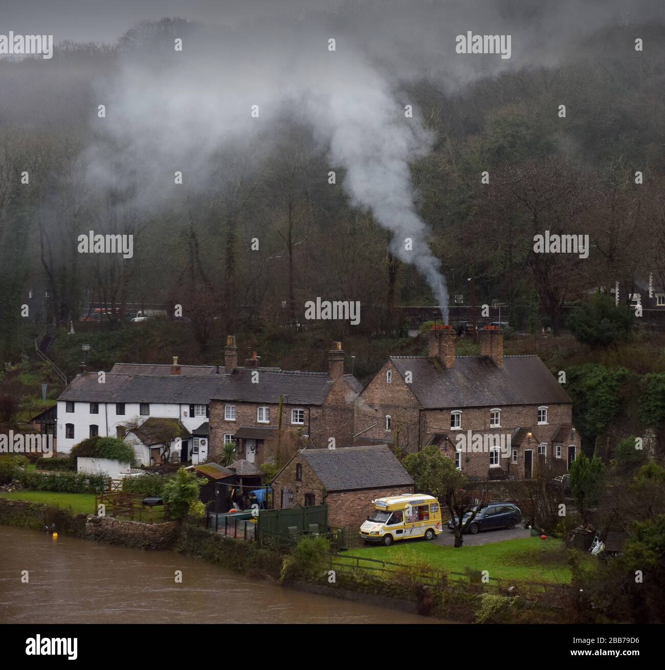 Chimney smoke from coal or log fire in Ironbridge Shropshire Uk Stock ...