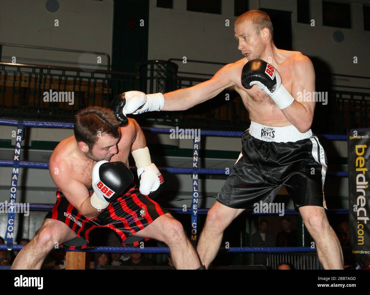 Mark Stupple (Bermondsey, black shorts) defeats Peter Dunn (Pontefract, red/black shorts) in a ...