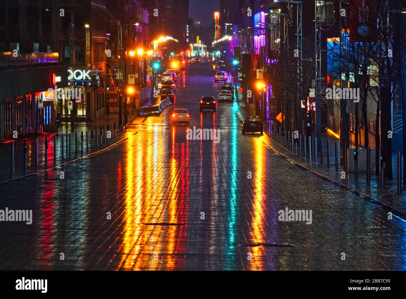 Montreal,Quebec,Canada,March 29, 2020.Street lights reflect in rain ...