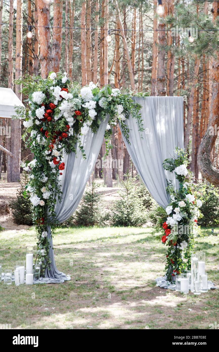 Wedding arch for wedding of newlyweds. Wedding celebration outdoors in ...