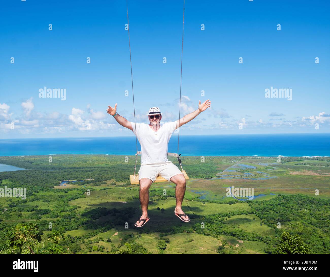 Man on swing hi-res stock photography and images - Alamy