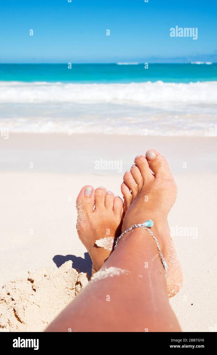 Beautiful tan legs photographed on the beach Stock Photo - Alamy