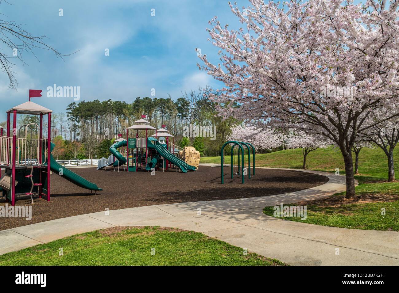Empty children playground with slides swings climbing wall and other ...