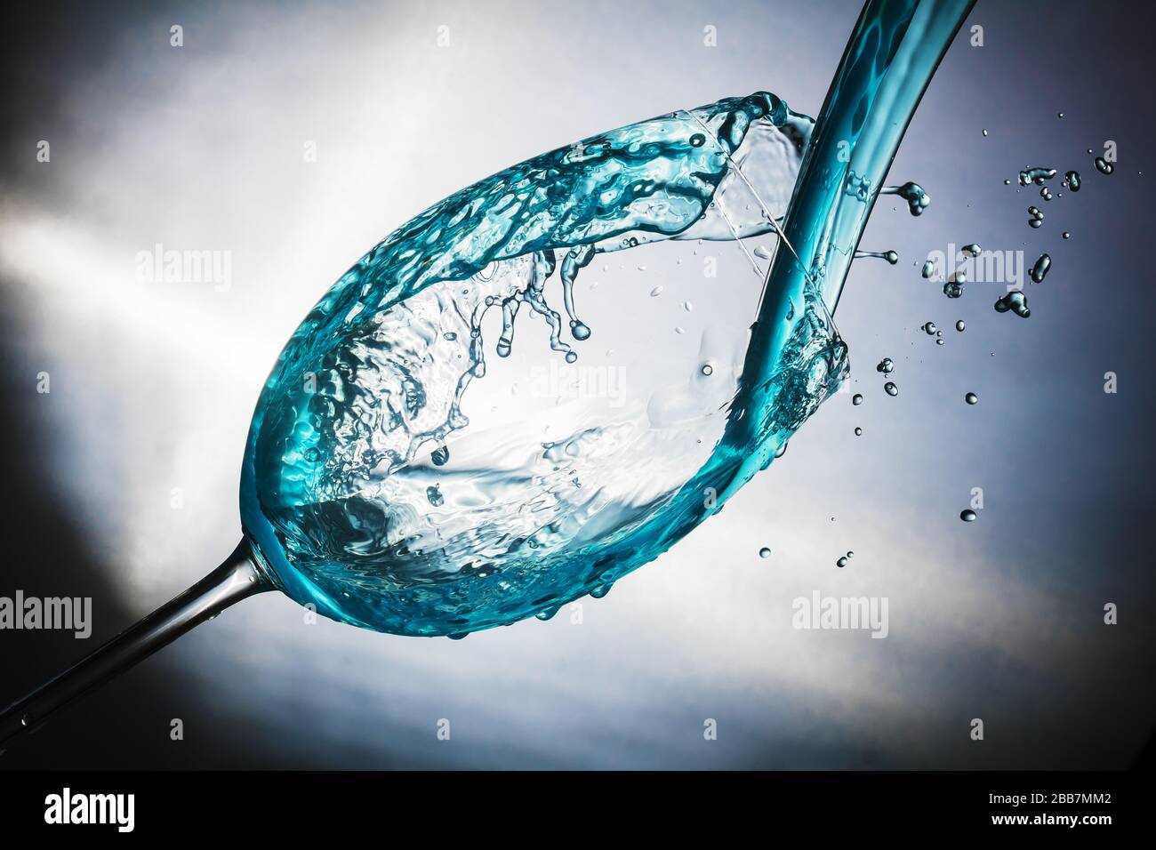 Beautiful spray colored water in a glass were photographed in the ...