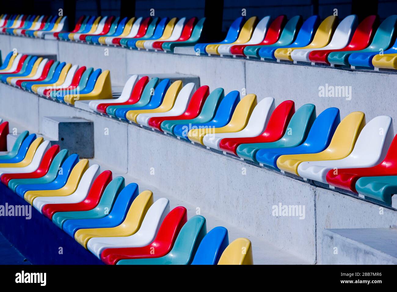 Colorful seats on the tier of the outdoor stadium Stock Photo - Alamy
