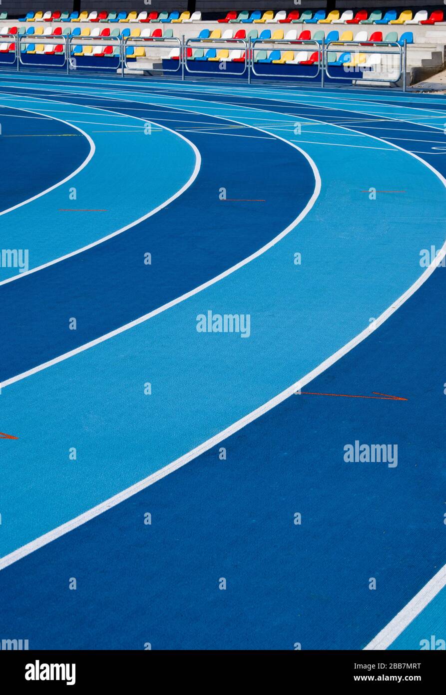 Running track and colorful seats for spectators Stock Photo - Alamy