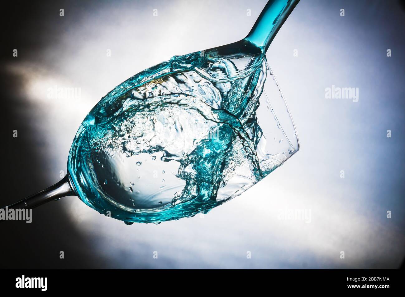 Beautiful spray colored water in a glass were photographed in the ...