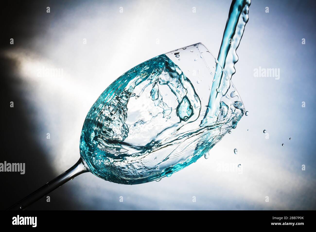 Beautiful spray colored water in a glass were photographed in the ...
