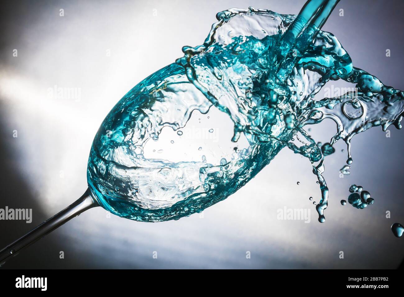 Beautiful spray colored water in a glass were photographed in the ...