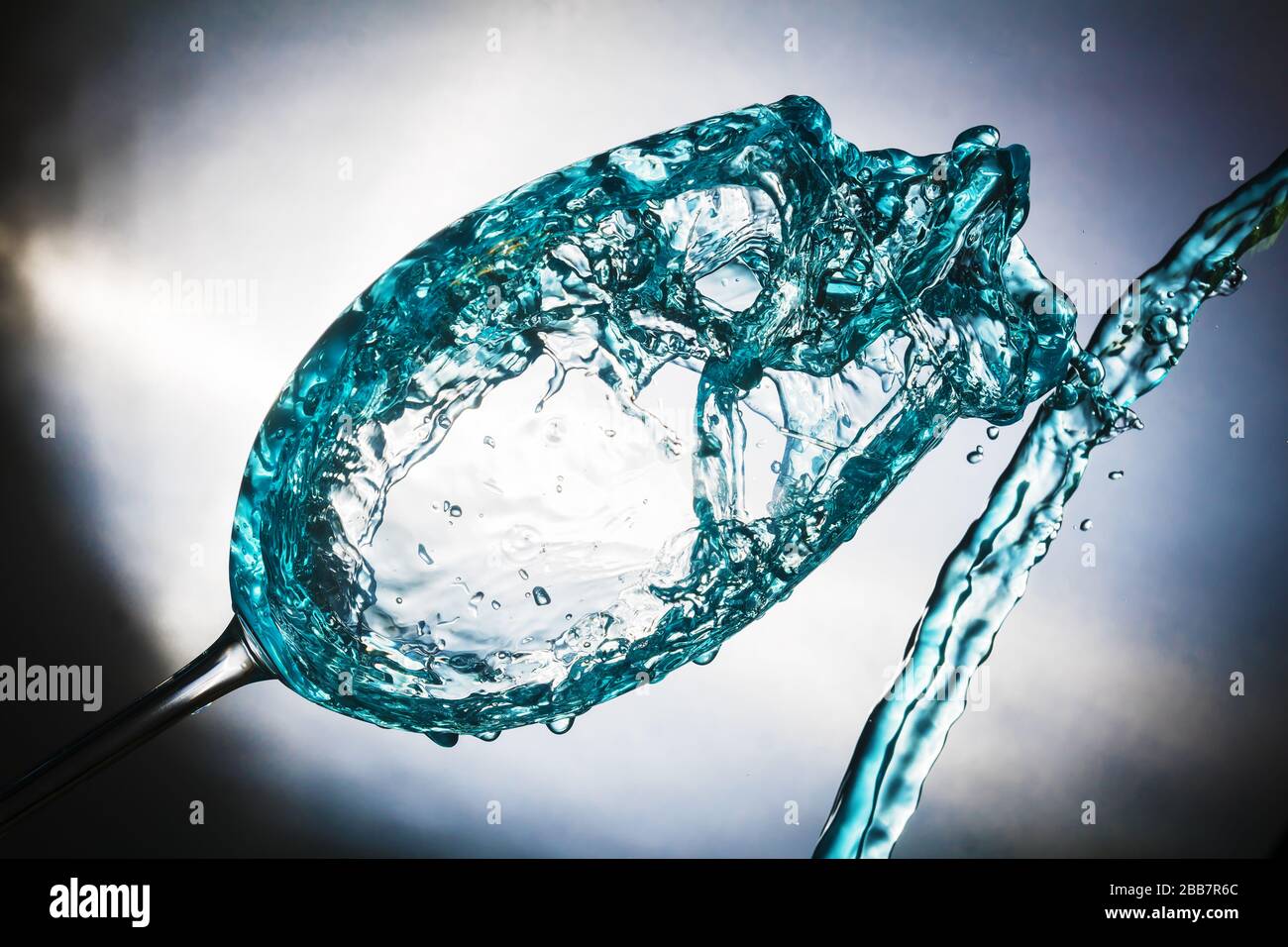 Beautiful spray colored water in a glass were photographed in the ...