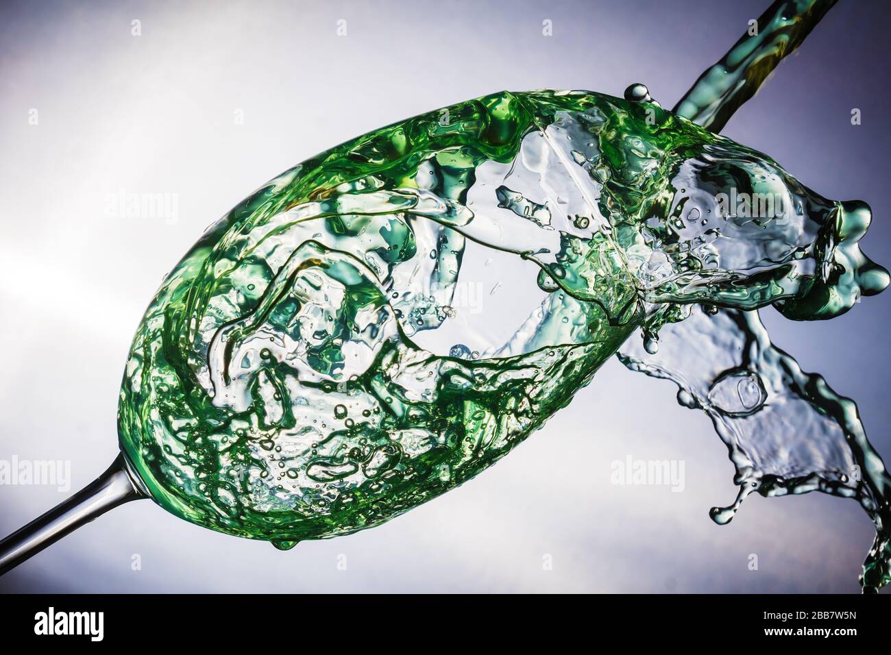 Beautiful spray colored water in a glass were photographed in the ...