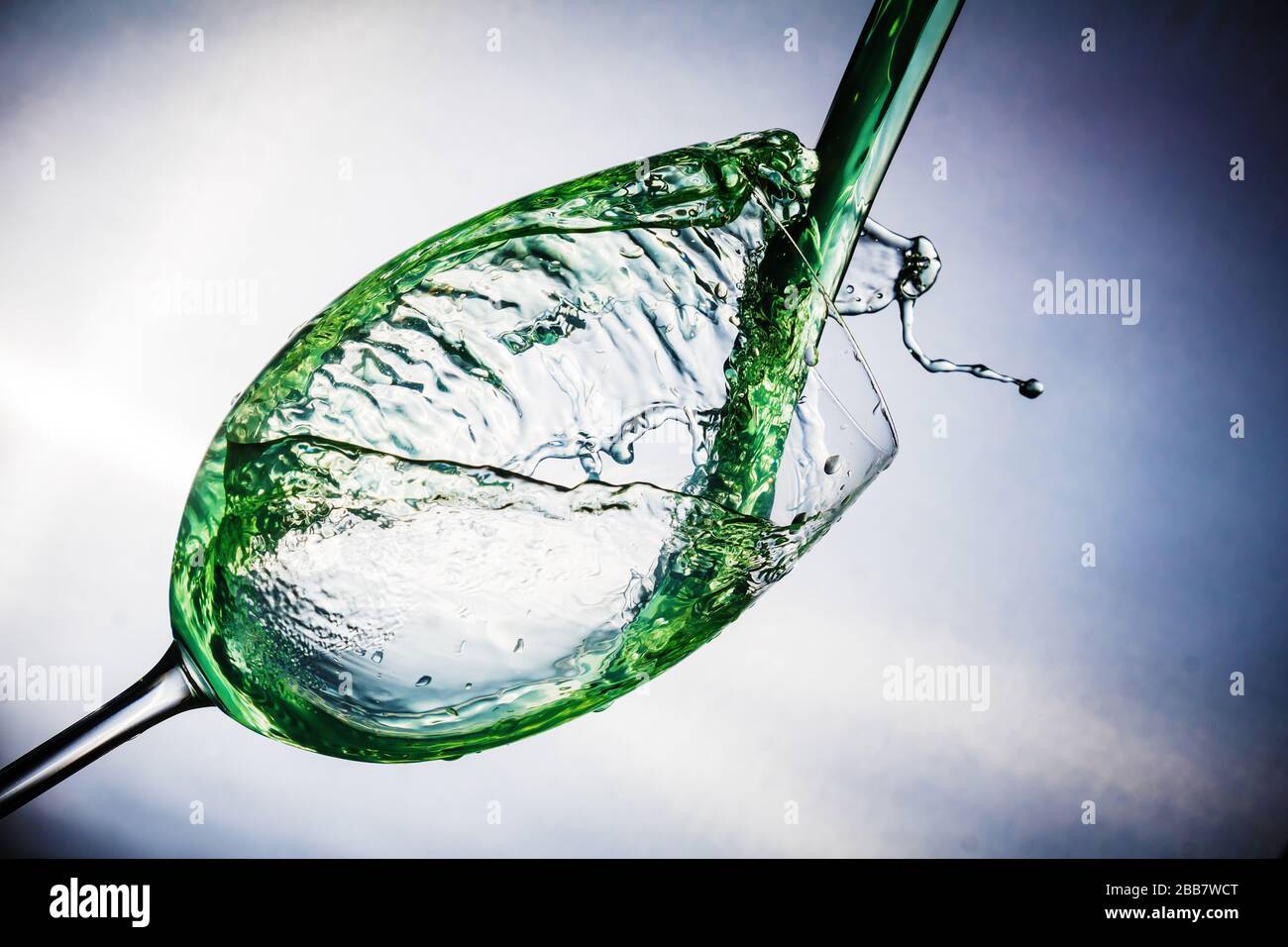 Beautiful spray colored water in a glass were photographed in the ...