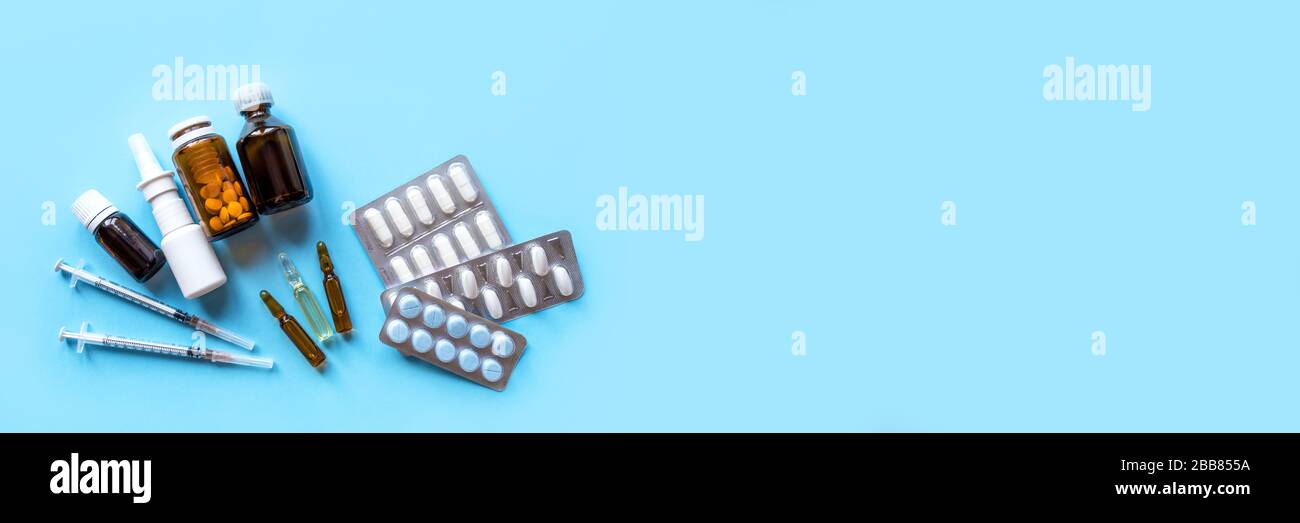 Tablets, pack of medicines with medicine bottles on a blue background ...