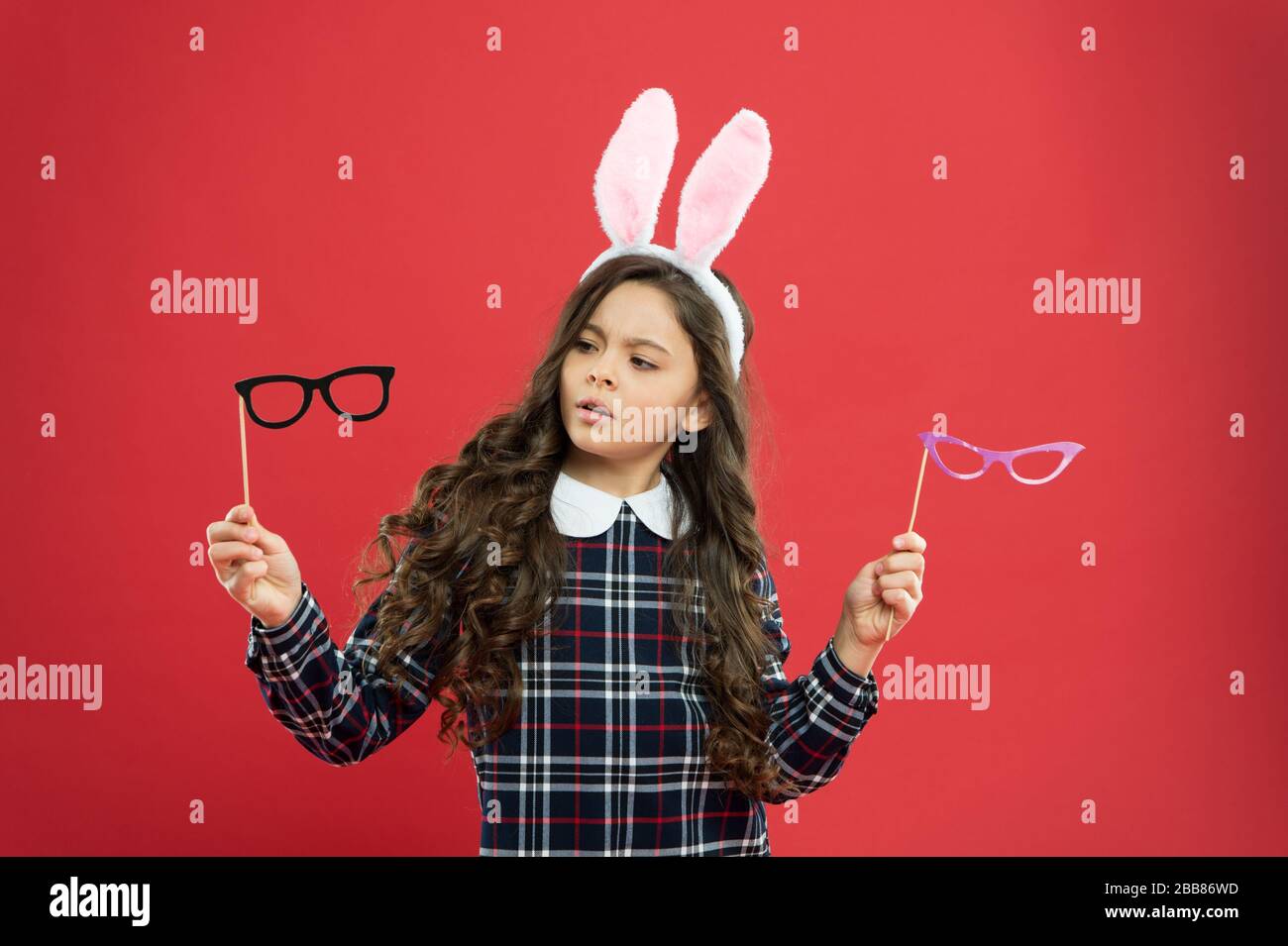 Party and social event. Girl in Easter bunny at egg hunt. Family ...