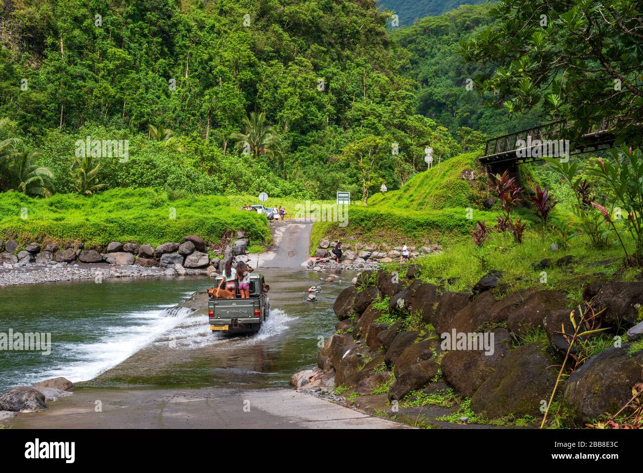 Tahiti, French Polynesia -- March 18, 2018. Young tourists stand in the ...