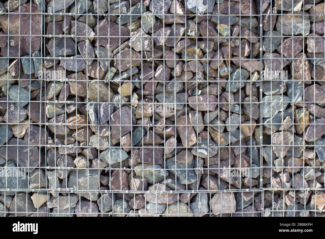 Gabion rock wall, stones in steel wire cage, decoration rocks cube in ...