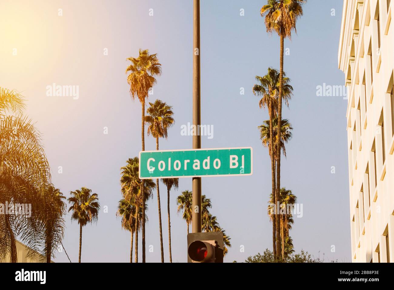 View of Colorado Blvd sign in Pasadena, CA with palm trees in the ...