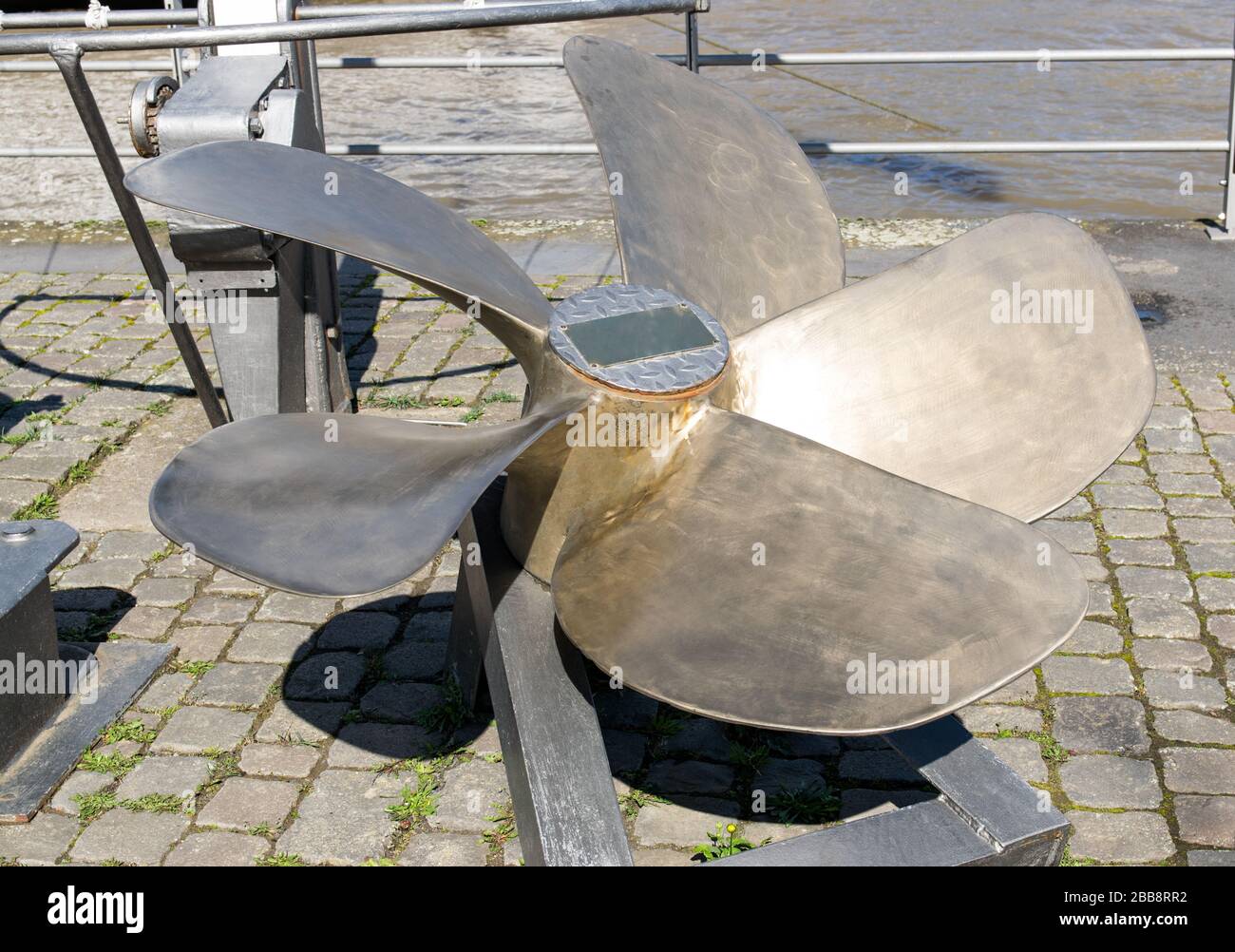 Screw. View of metal ship propeller near with river Stock Photo - Alamy