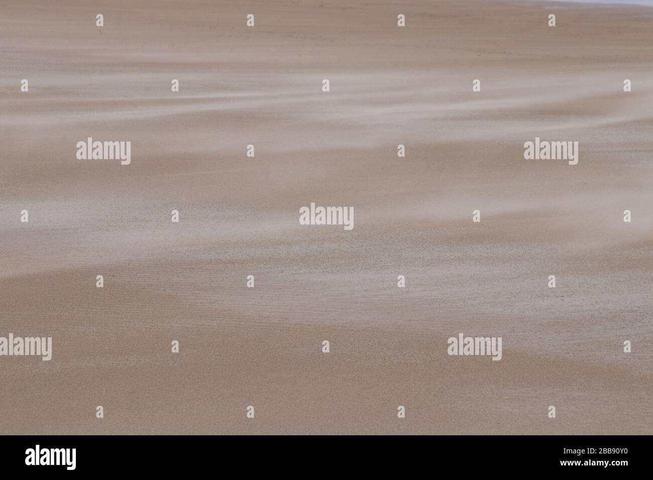 Wind-driven sand by sea Stock Photo - Alamy