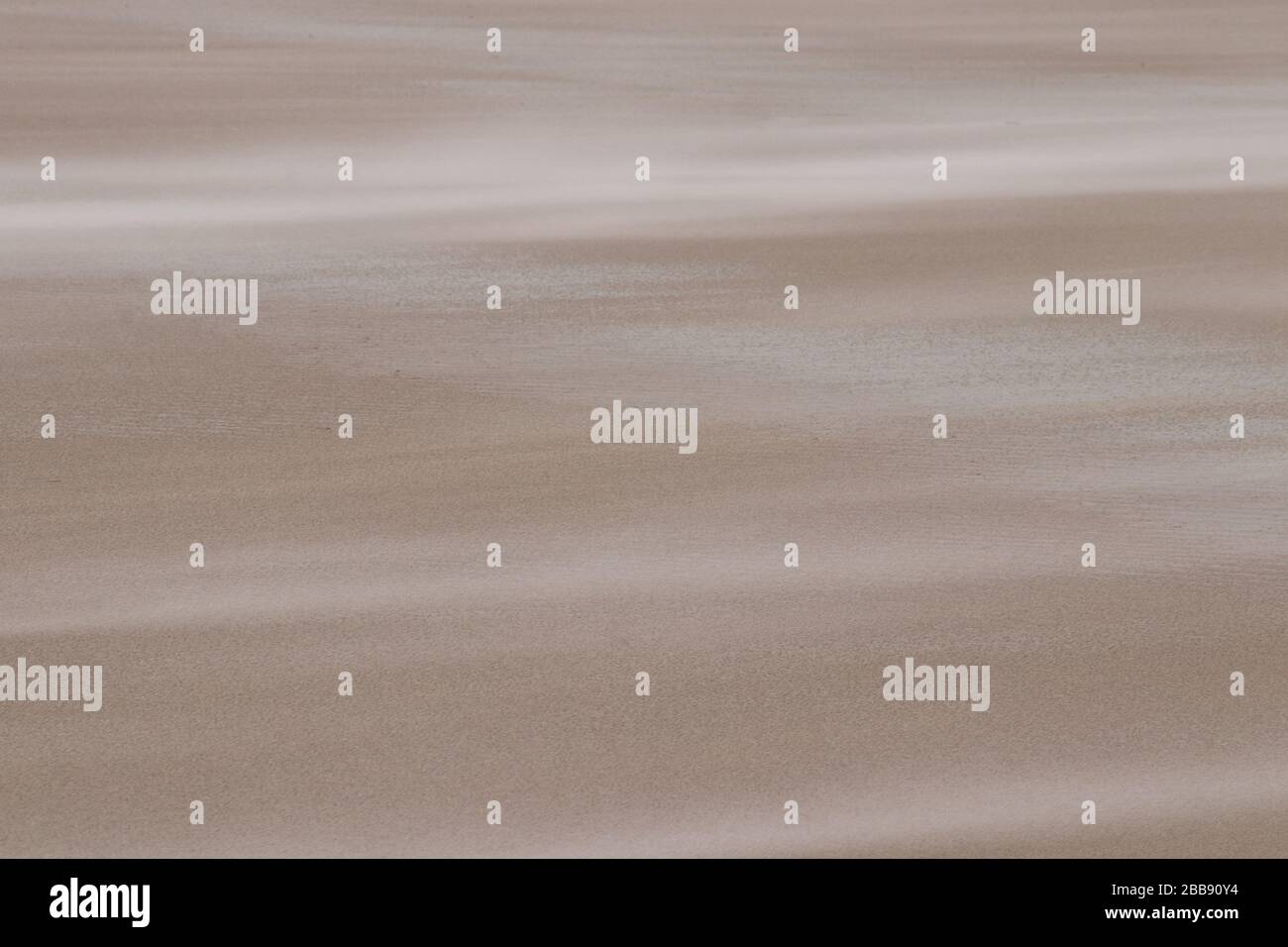 Wind-driven sand by sea Stock Photo - Alamy
