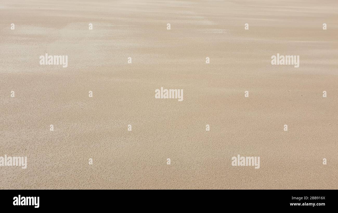Wind-driven sand by sea Stock Photo - Alamy