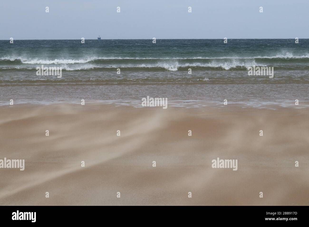 Wind-driven sand by sea Stock Photo - Alamy