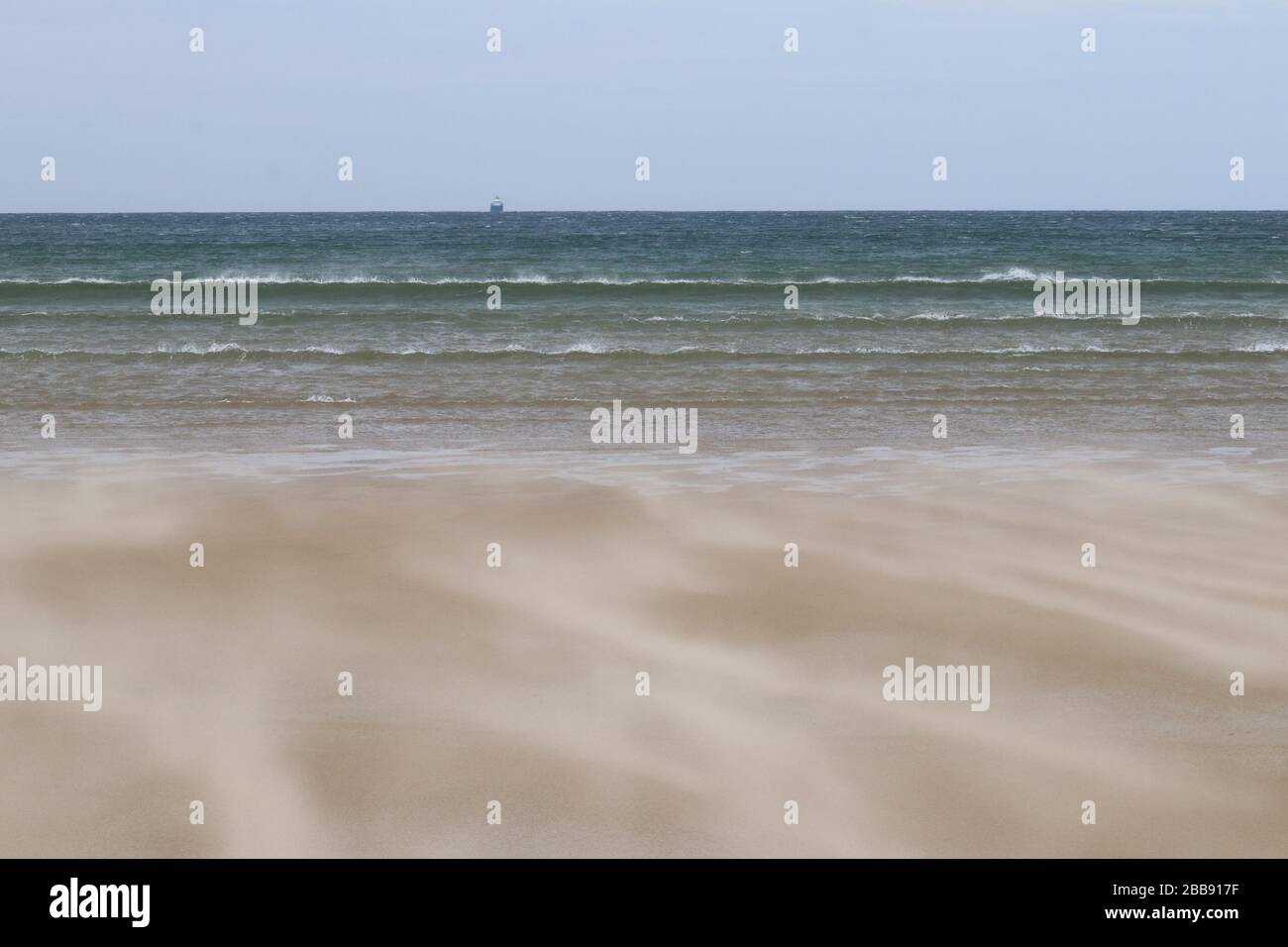 Wind-driven sand by sea Stock Photo - Alamy