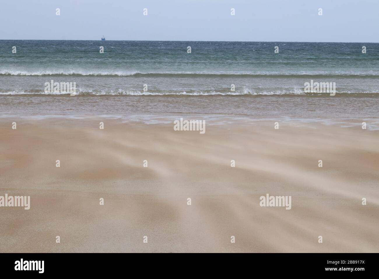 Wind-driven sand by sea Stock Photo - Alamy