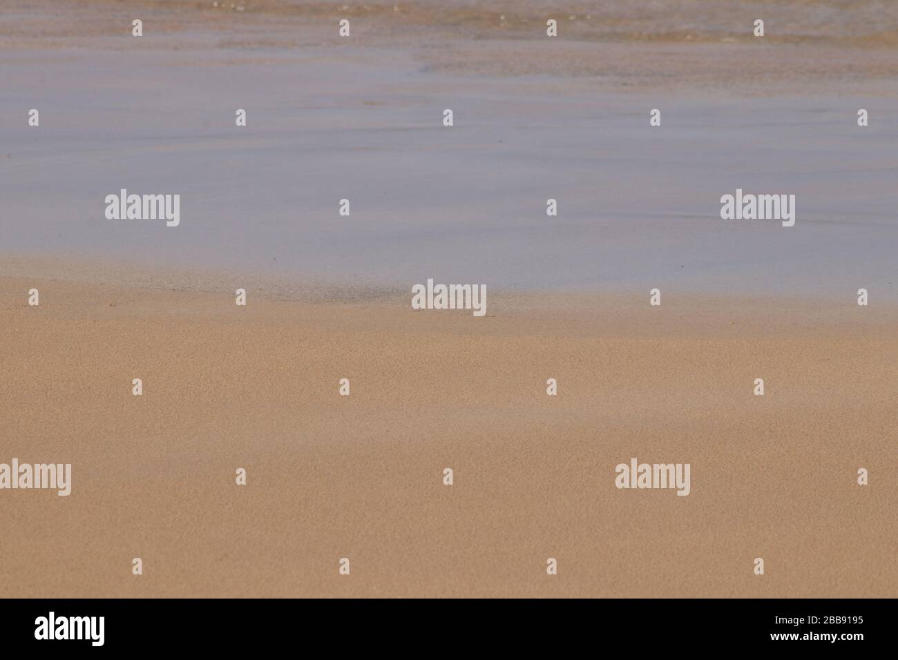 Wind-driven sand by sea Stock Photo - Alamy