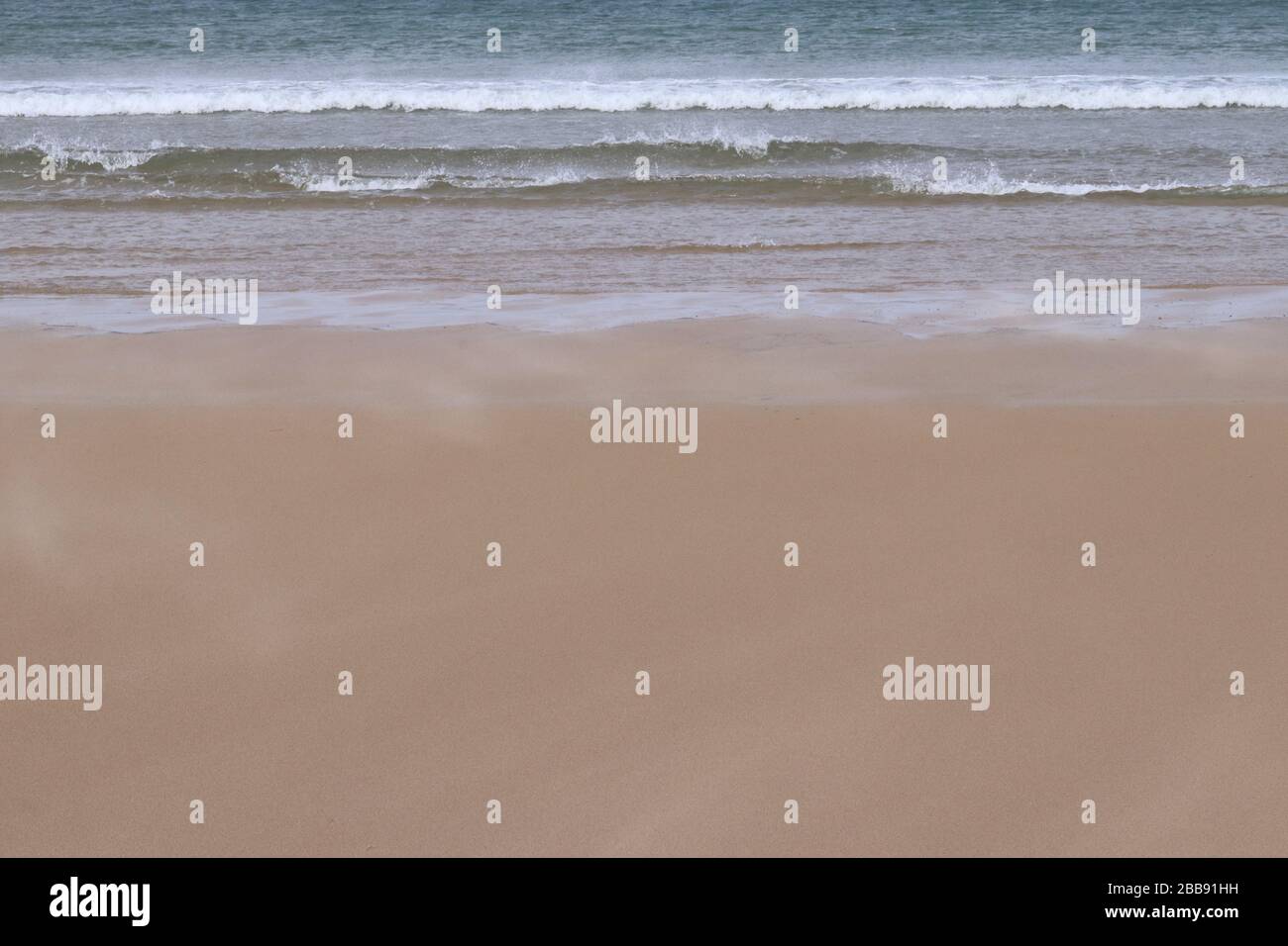 Wind-driven sand by sea Stock Photo - Alamy