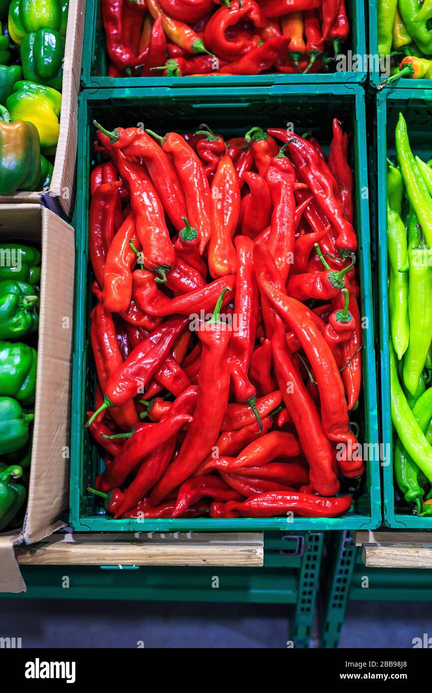 Plastic boxes with hot red hot chilli peppers in markets Stock Photo ...