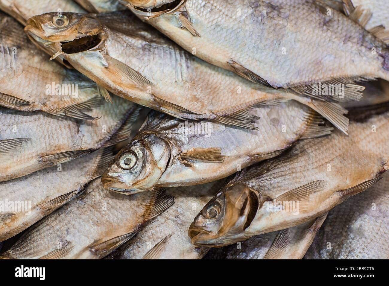 Dried fish background. Salty dry river fish top view with copy space ...