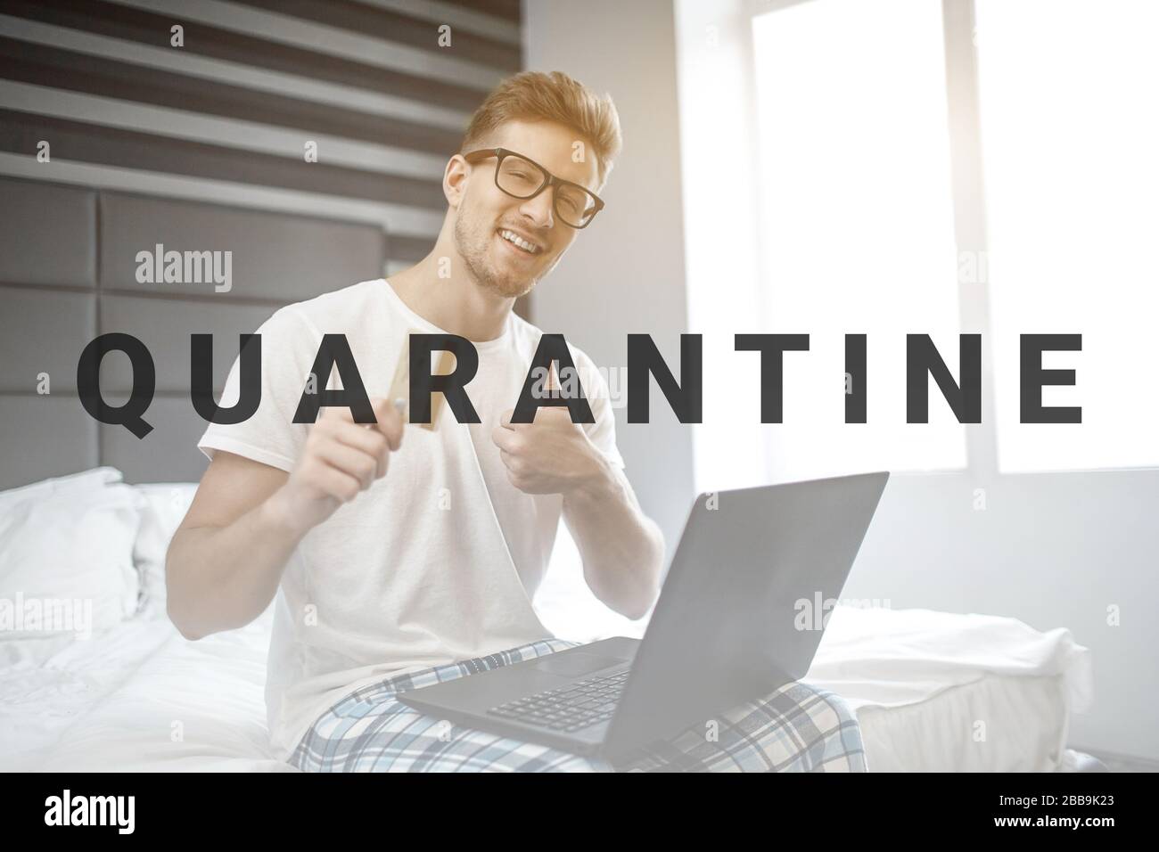Young man sitting on edge bed hi-res stock photography and images - Alamy