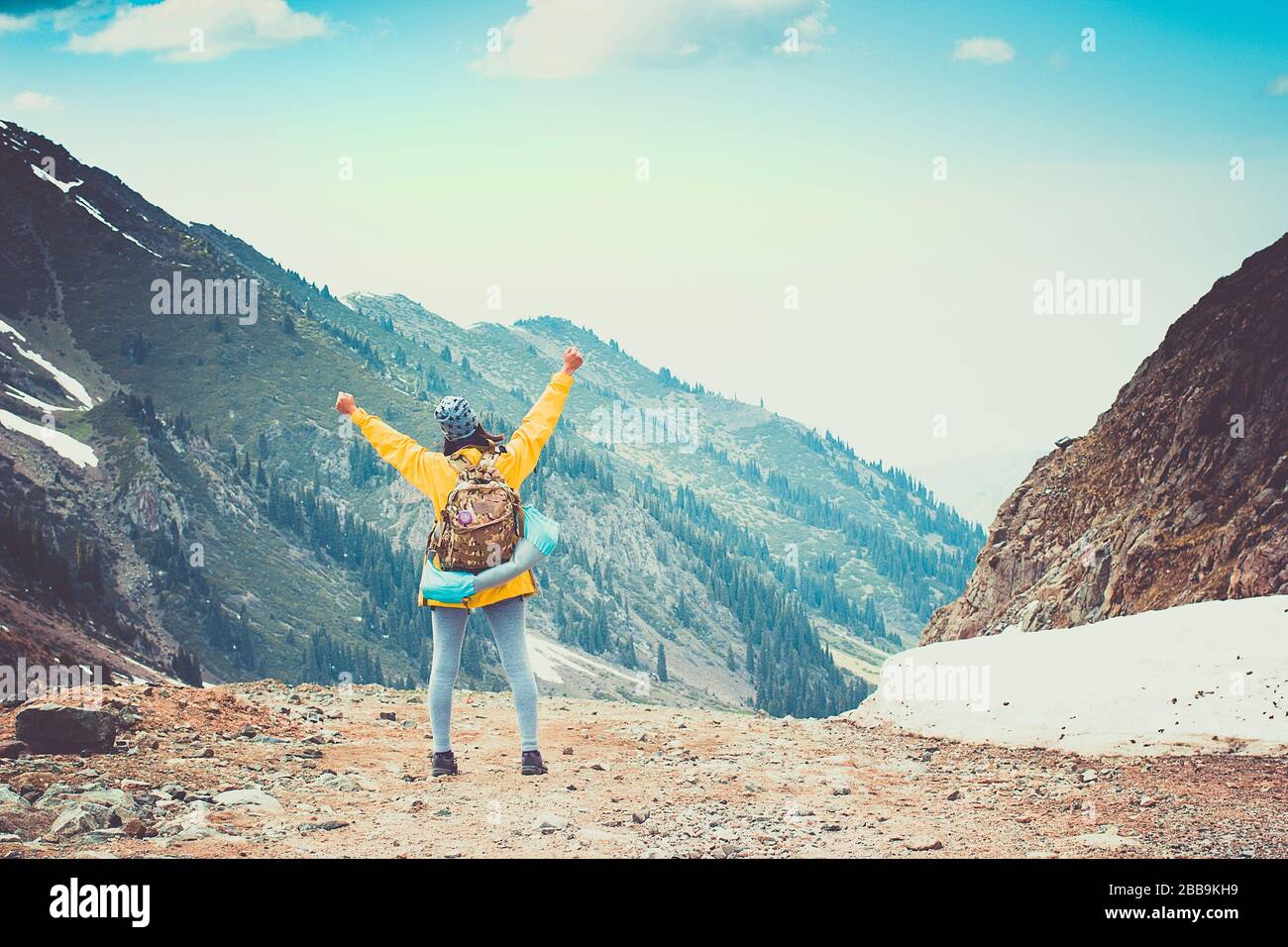 Happy hiker winning reaching life goal, success, freedom and happiness ...