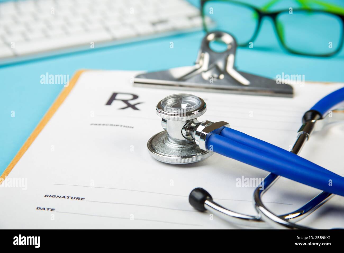 keyboard and Medical stethoscope lying on cardiogram chart closeup ...