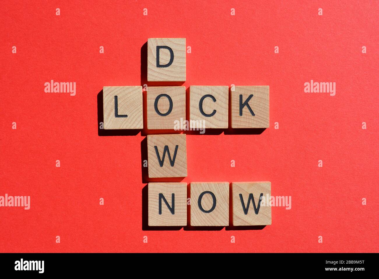 Lock Down, Now, words on red background Stock Photo - Alamy