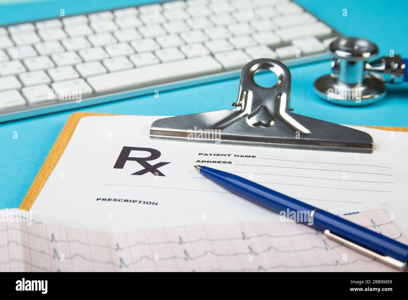 keyboard and Medical stethoscope lying on cardiogram chart closeup ...