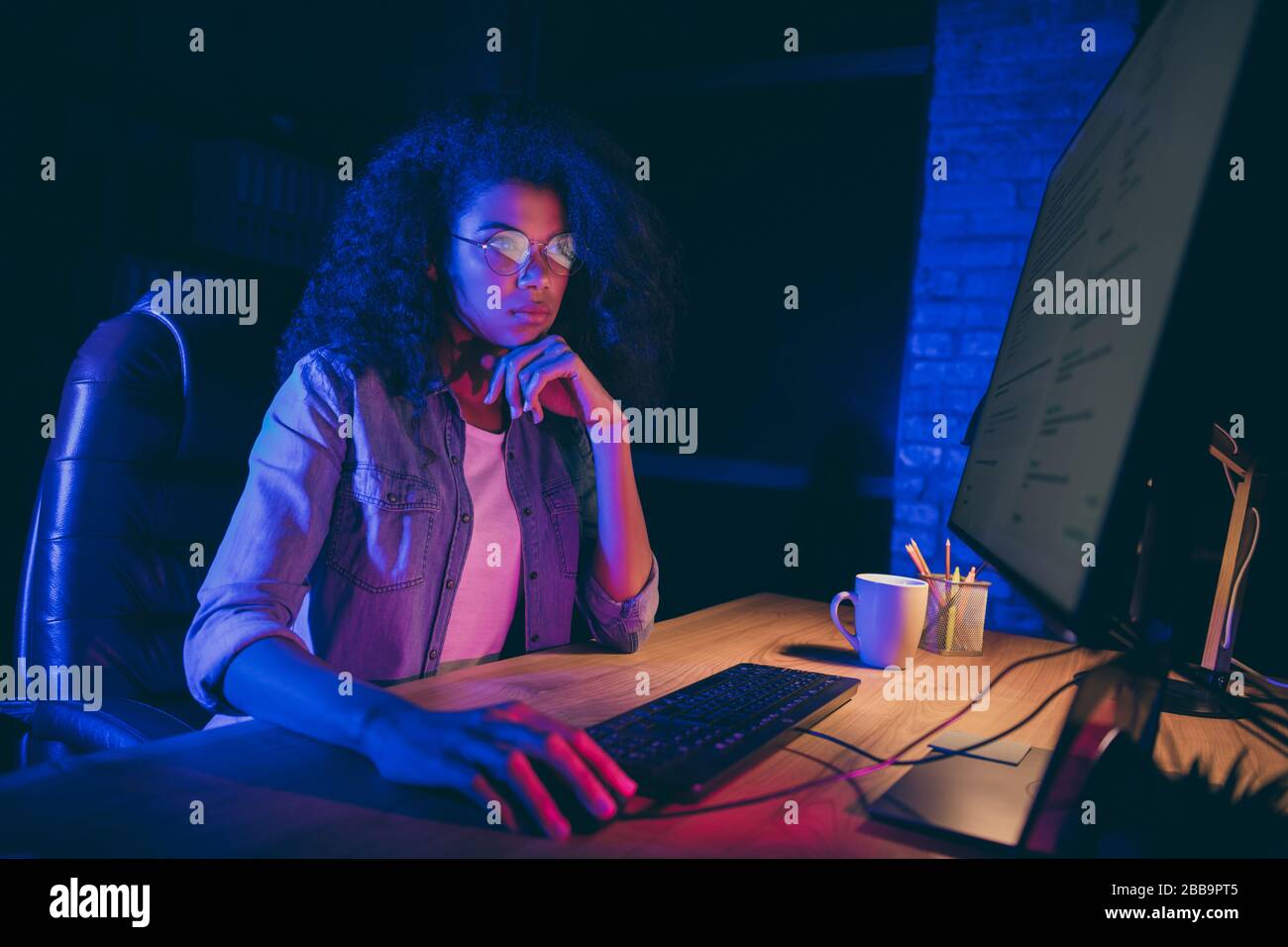 Profile photo of workaholic dark skin programmer lady look screen monitor check debugging system ...