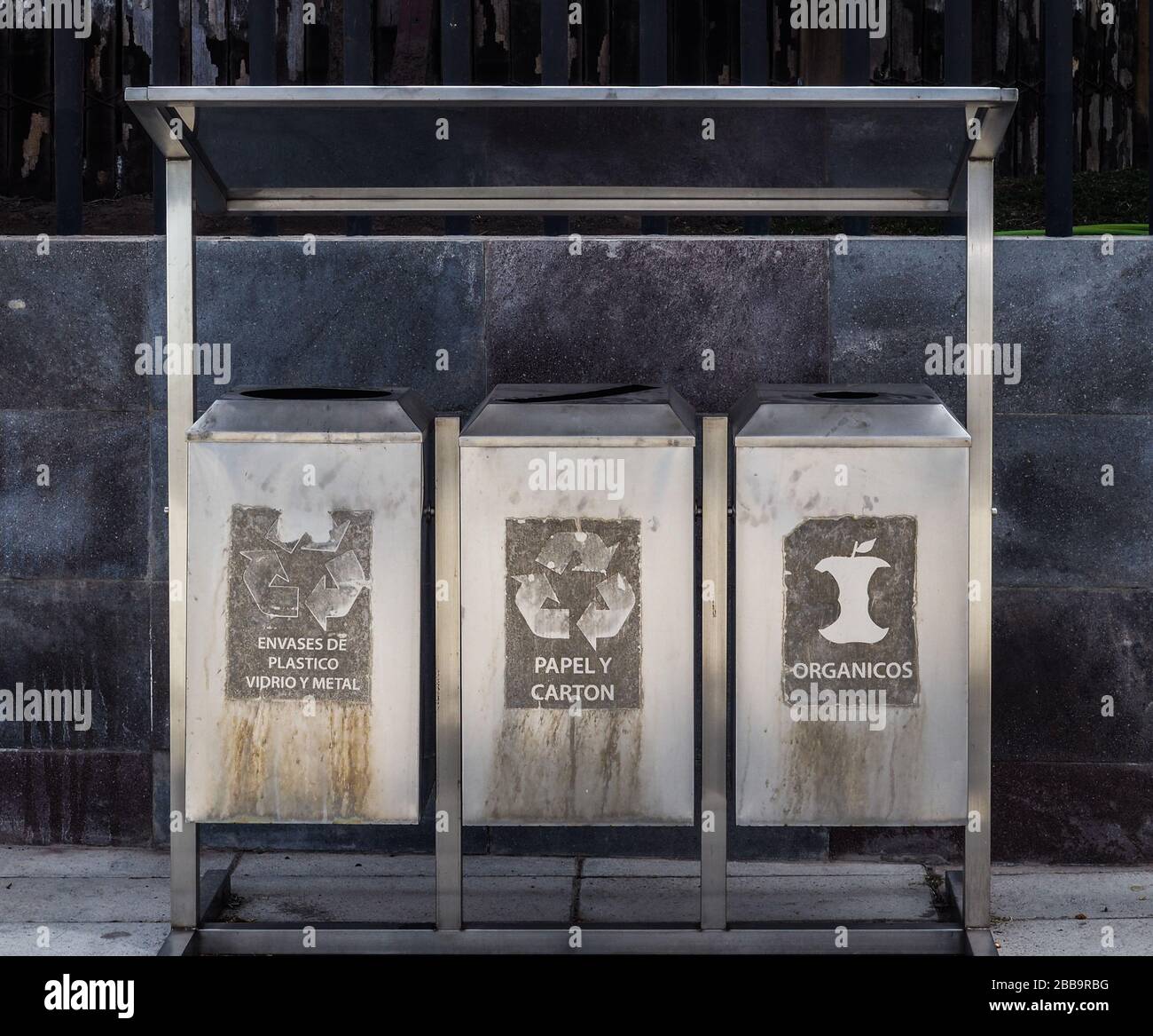 Three metal recycling containers in Ecuador Stock Photo - Alamy