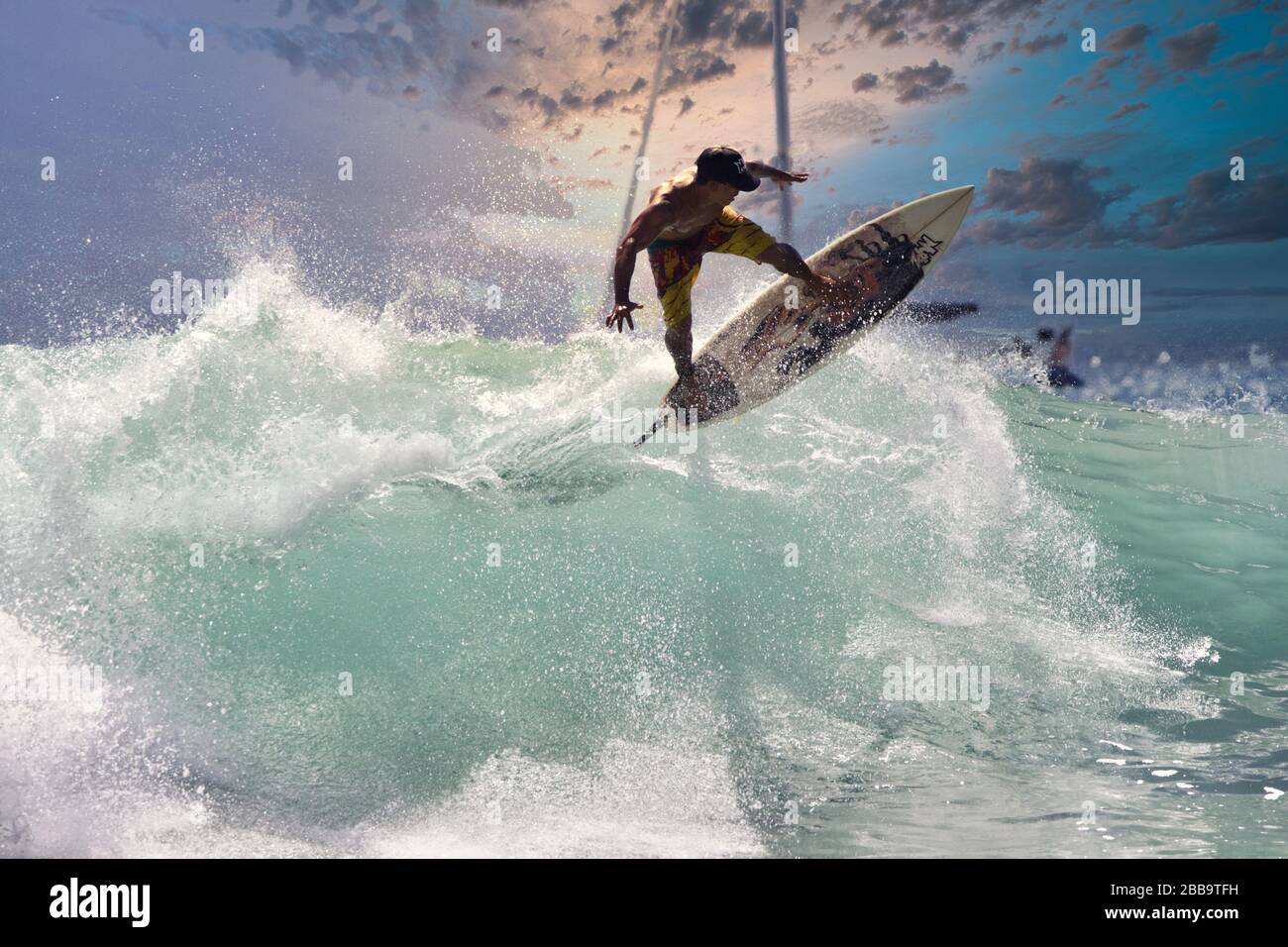 Stop action photo of a dramatic surfer at sunset Stock Photo - Alamy