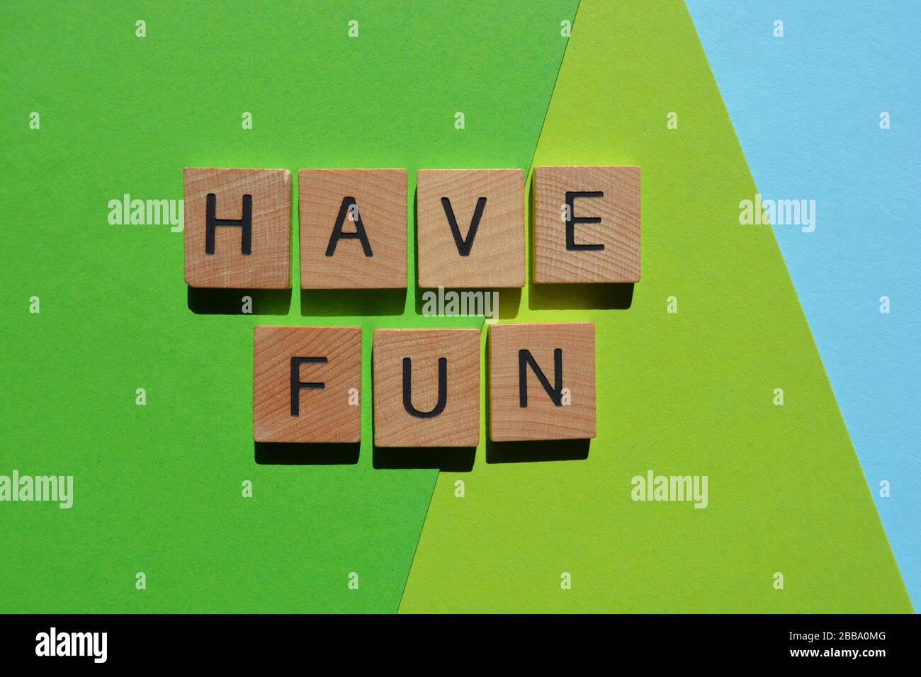 Have Fun, words on green background Stock Photo - Alamy
