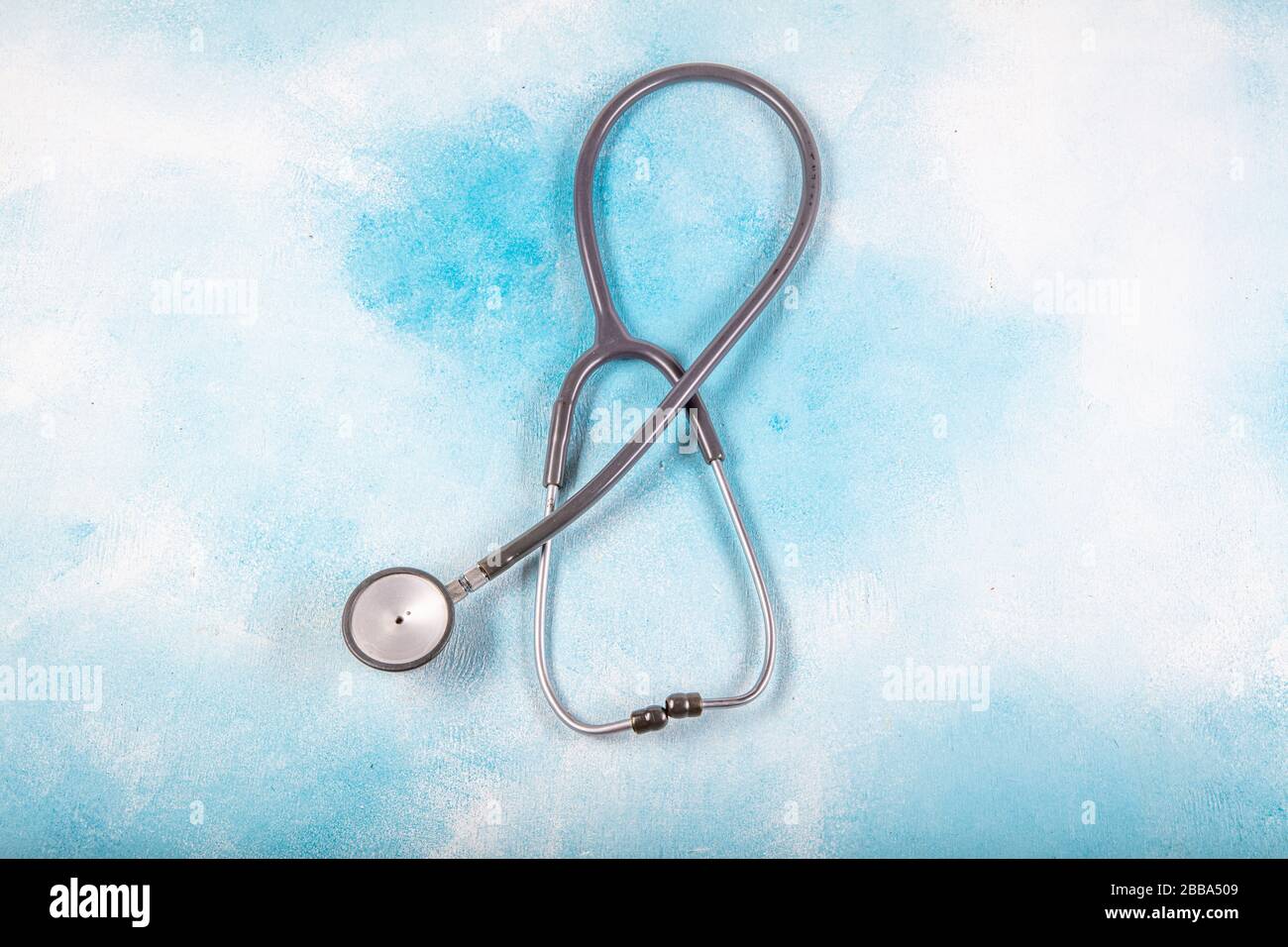 Modern stethoscope on blue table, closeup Stock Photo - Alamy