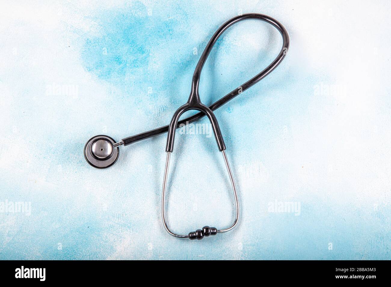 Modern stethoscope on blue hi-res stock photography and images - Alamy