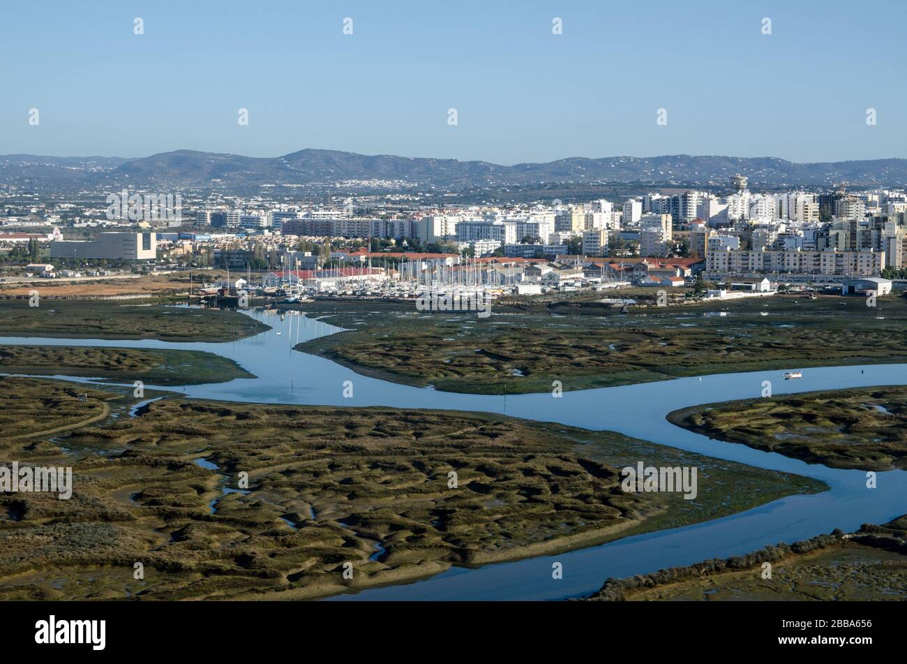 Aerial view of the salt marsh between Faro City centre and the Atlantic ...