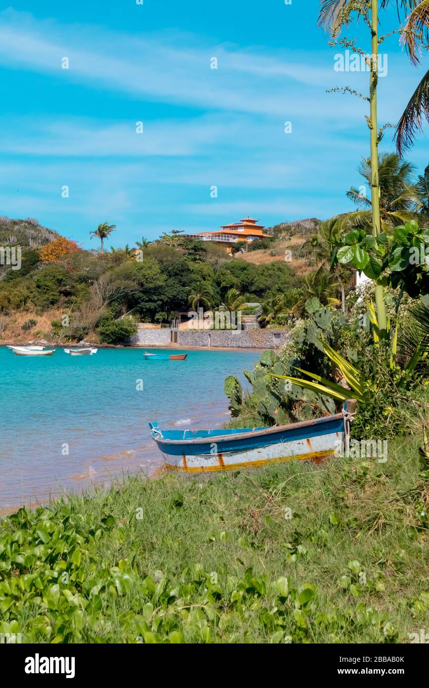 Small wooden bard, standing in the vegetation of Ferradura beach, with ...