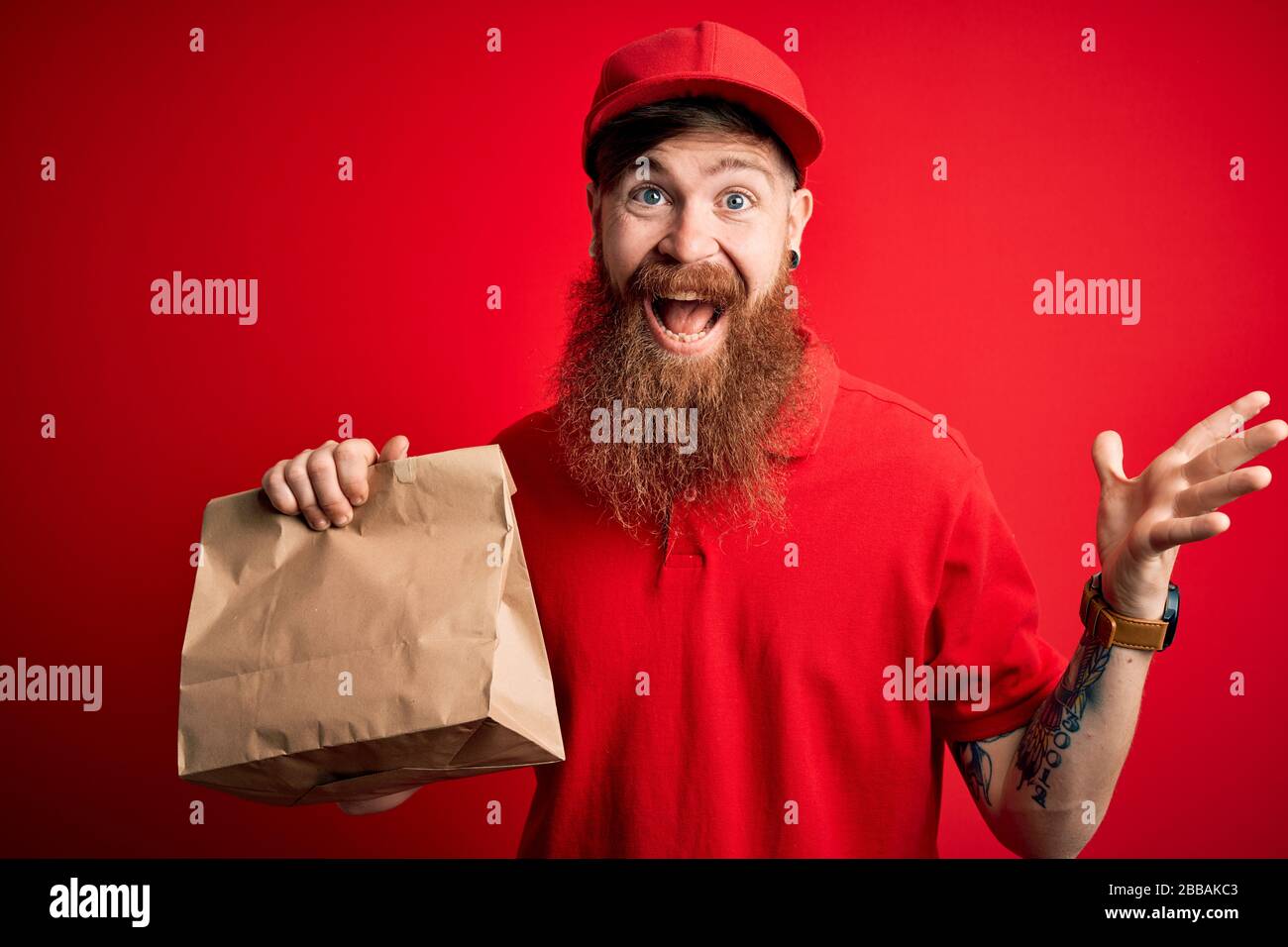 Redhead Irish Delivery Man With Beard Holding Takeaway Paper Bag Over