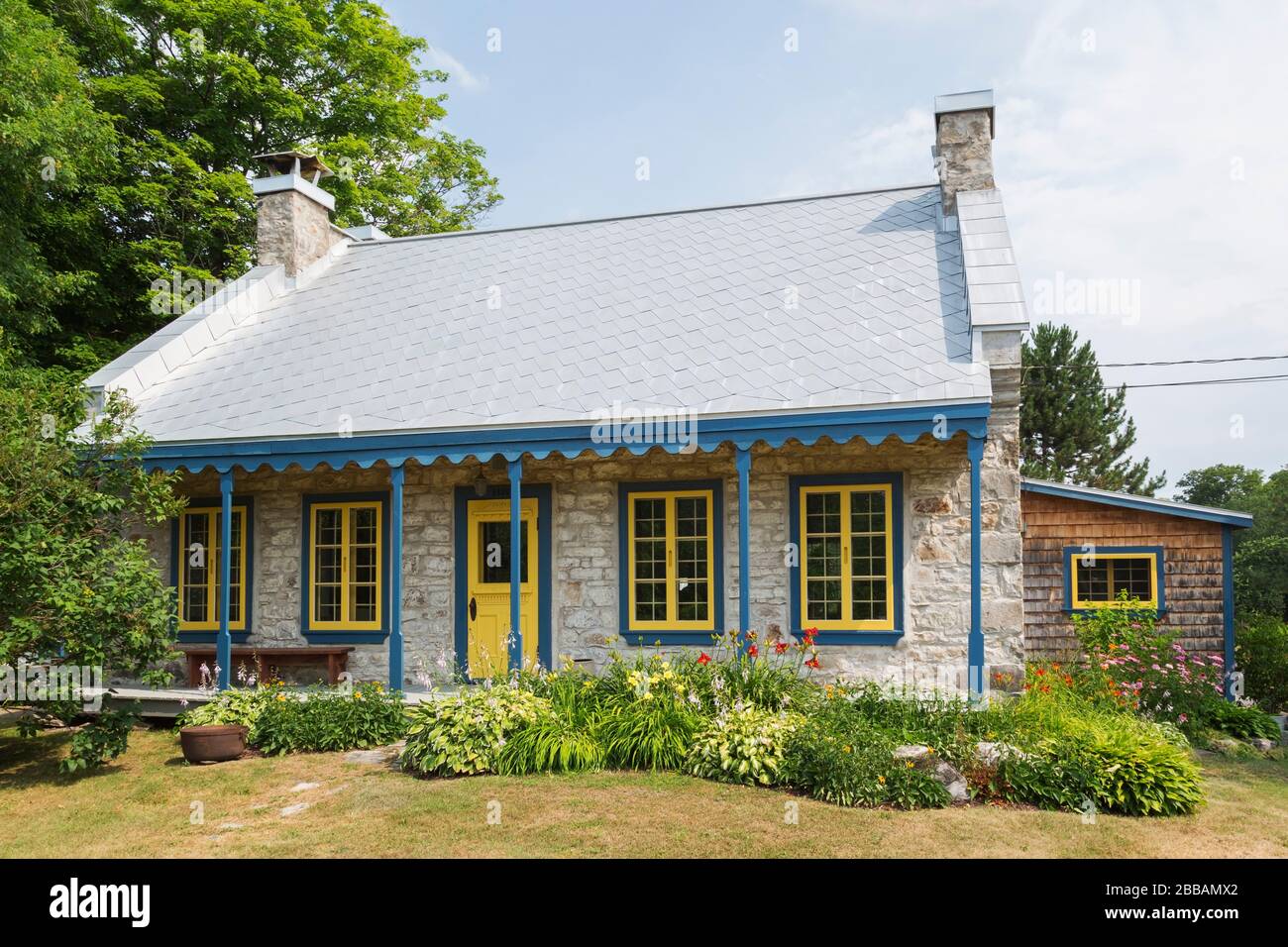 Old 1841 cottage style fieldstone house facade with hosta plants hi-res ...